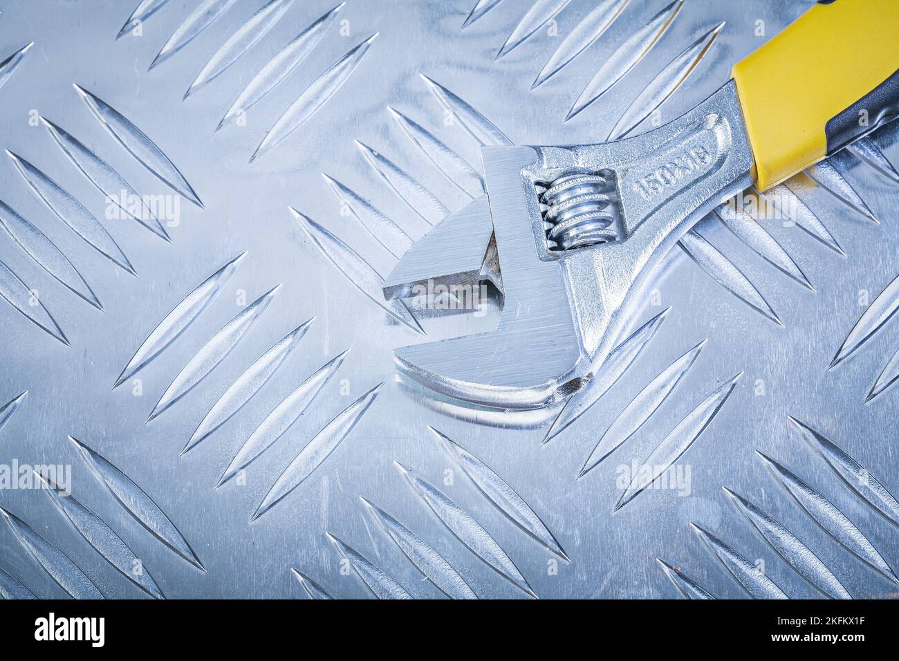 Adjustable spanner on corrugated metal plate construction concept Stock ...