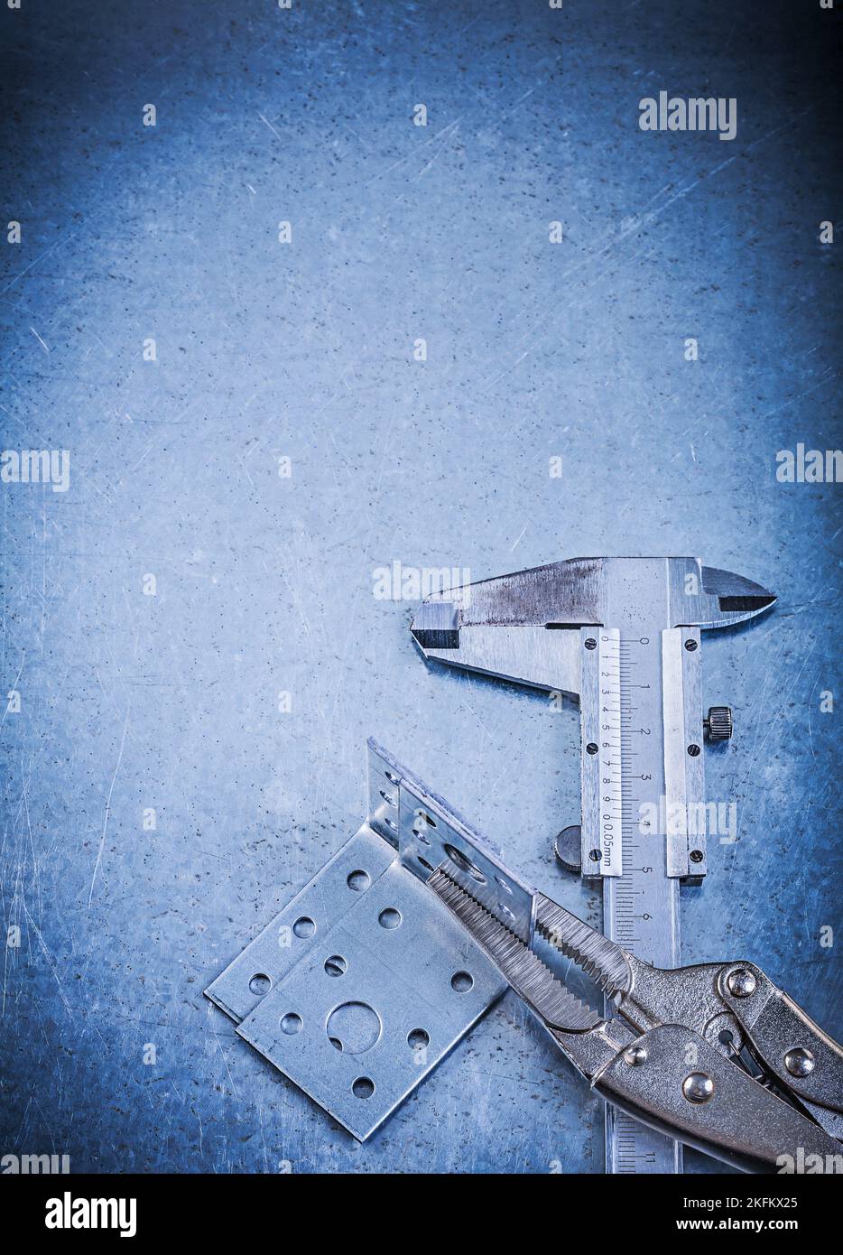 Adjustable pliers wrench slide caliper angle bracket on metallic ...
