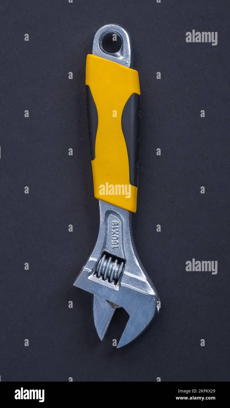 adjustable wrench on black background Stock Photo - Alamy