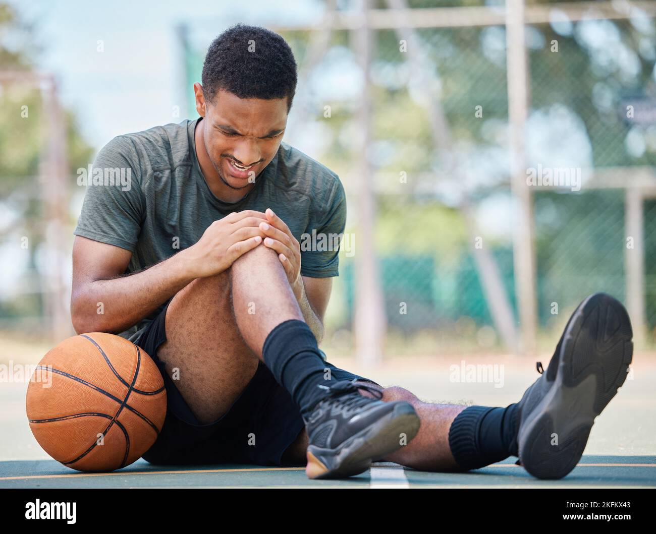 Basketball court, man and injury, knee pain and joint pain, fitness ...