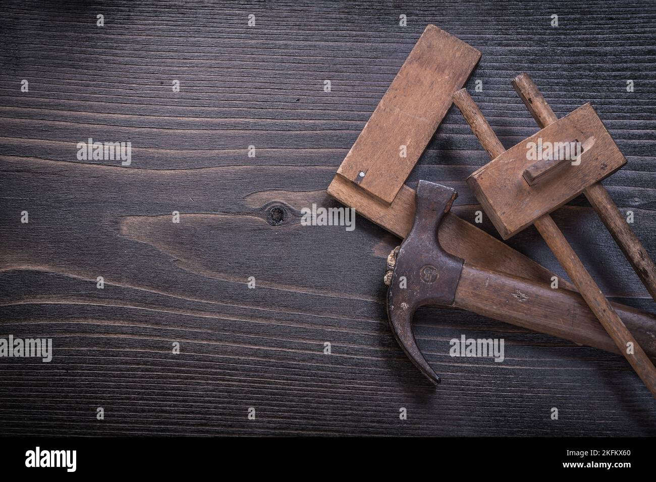 Age-old claw hammer square ruler carpenter gauge on wood board Stock ...