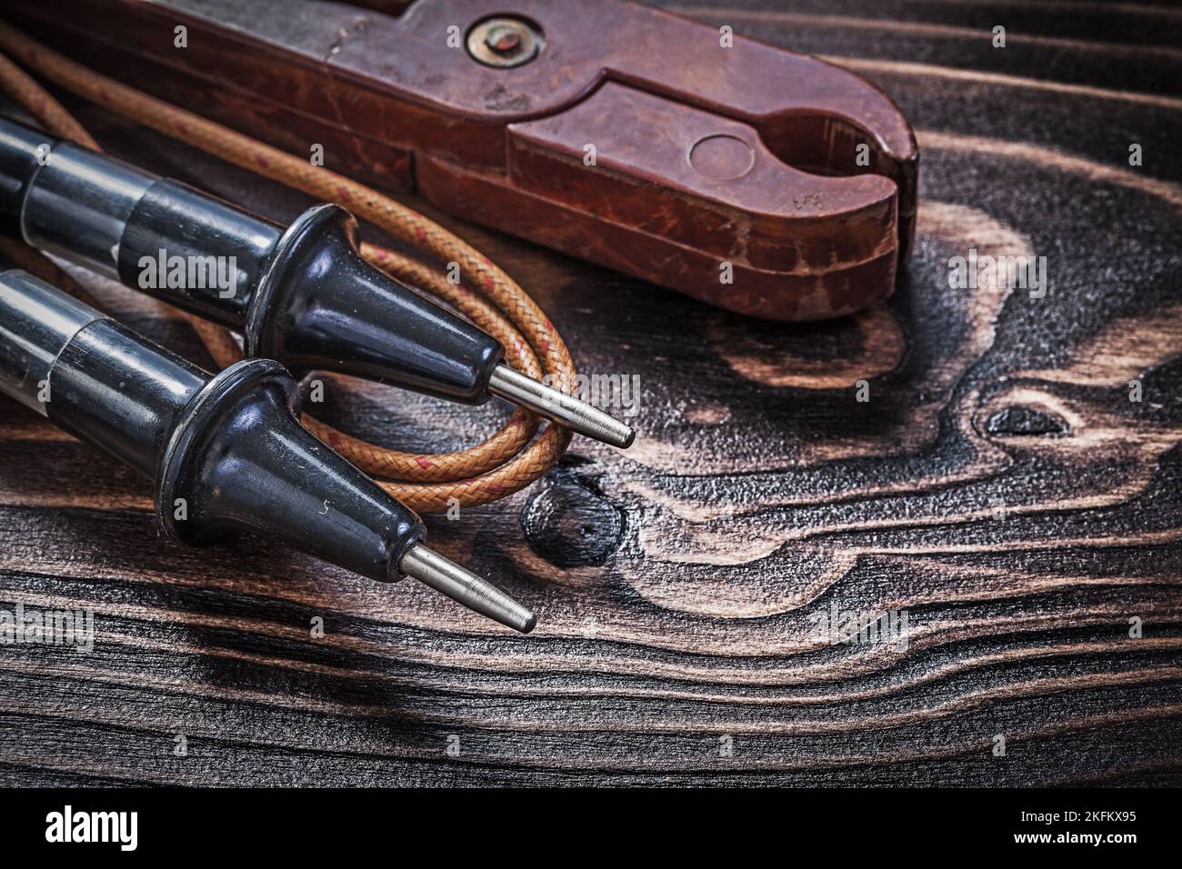 Antique electrical tester rusty pliers on vintage wooden board ...