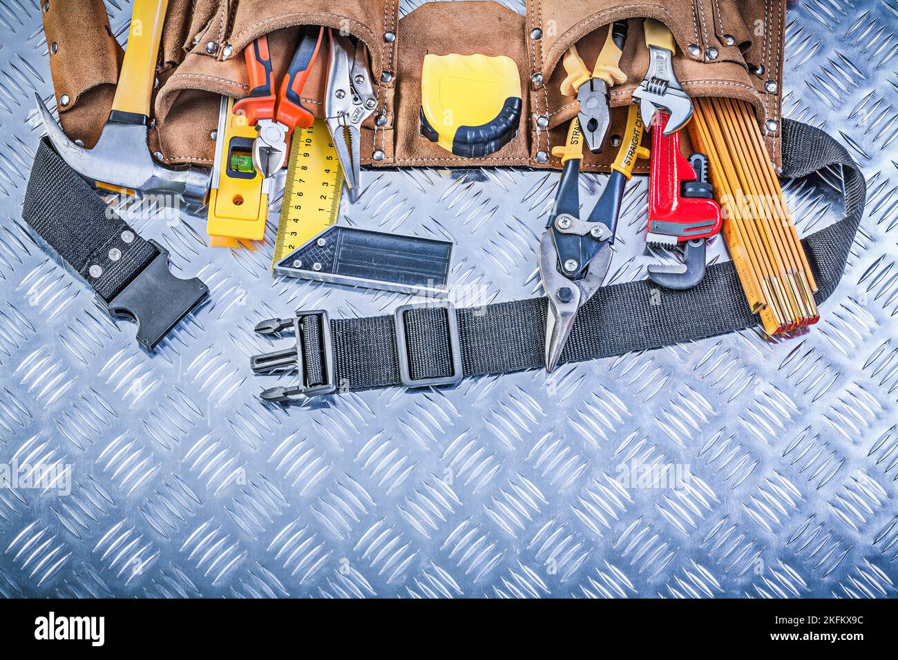 Assortment of construction tooling in leather building belt on ...