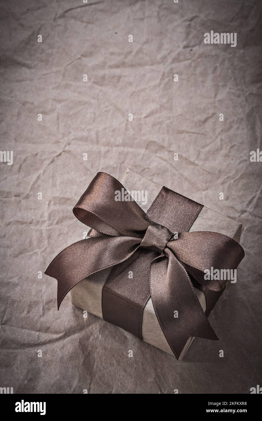 Birthday giftbox with brown tape on wrapping paper holidays concept ...