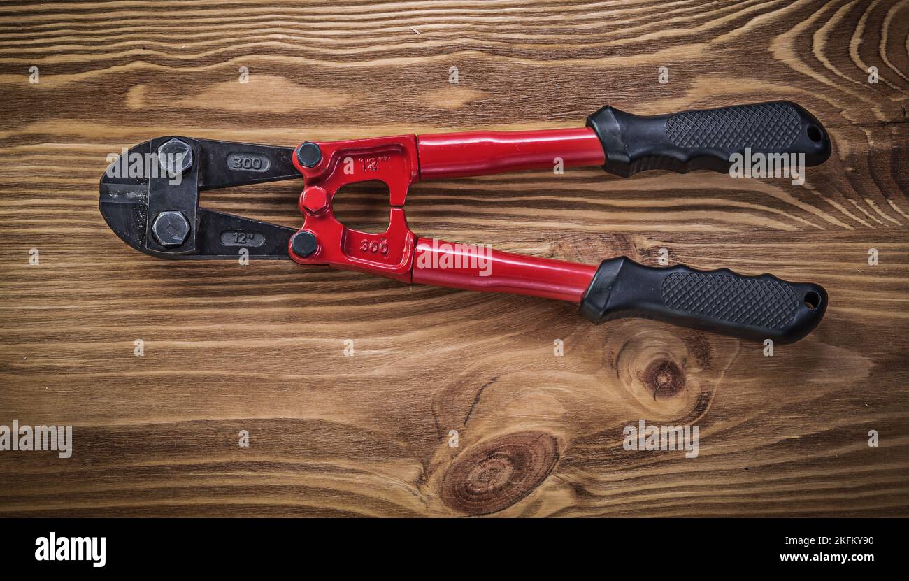 Bolt cutter on vintage wooden board construction concept Stock Photo ...