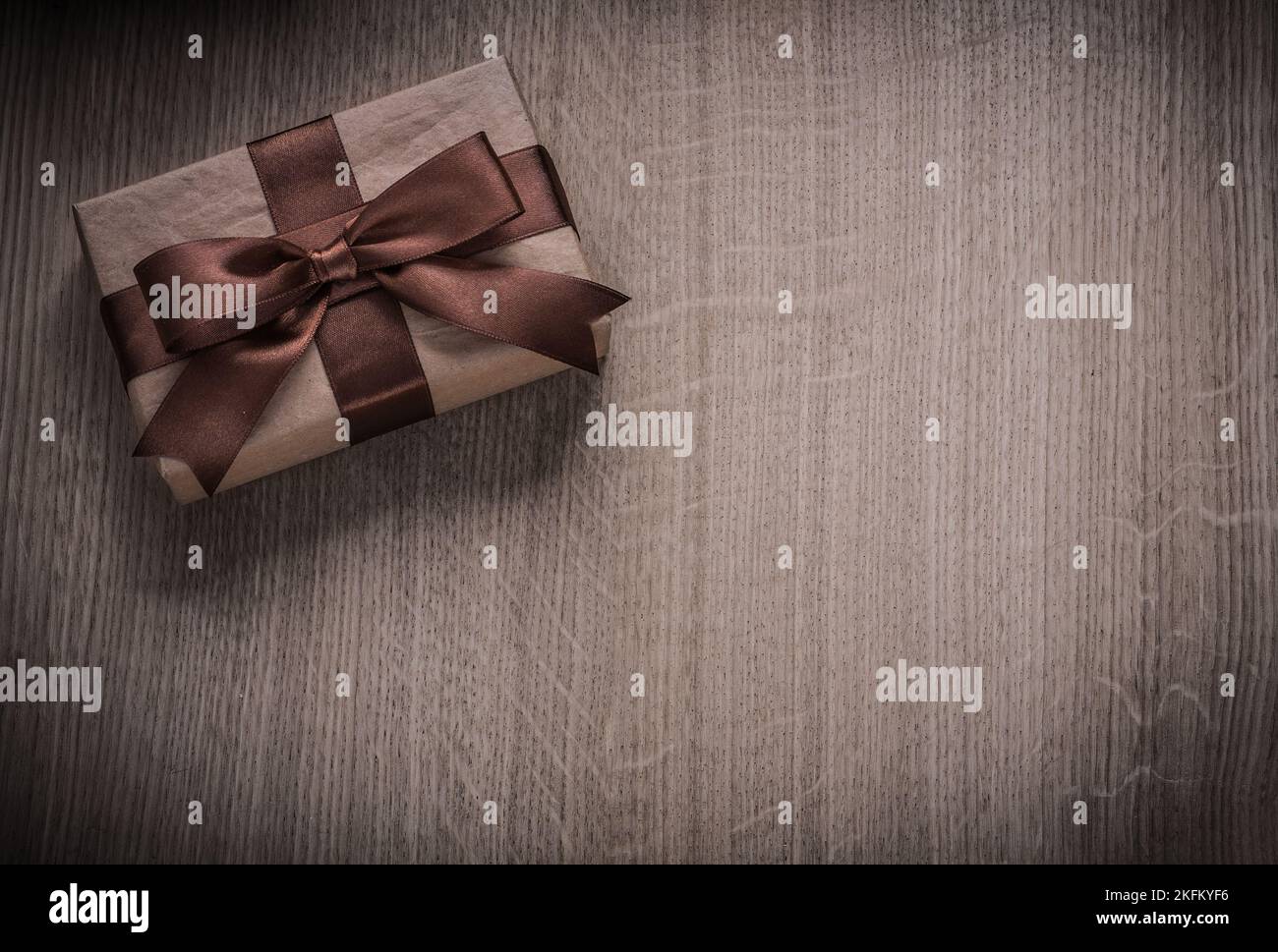 Boxed vintage present container with brown ribbon celebration concept ...