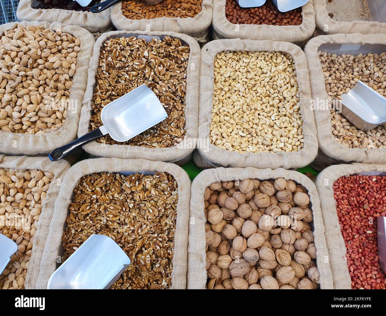 Different types of nuts a lot in farmer shop. Top view. Natural Walnuts ...