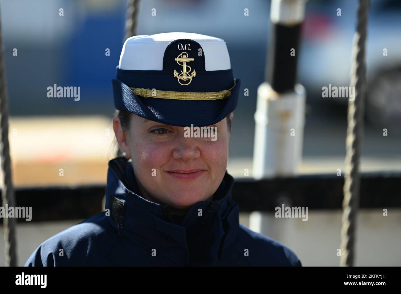 An officer candidate aboard the Coast Guard Cutter Eagle smiles for a ...