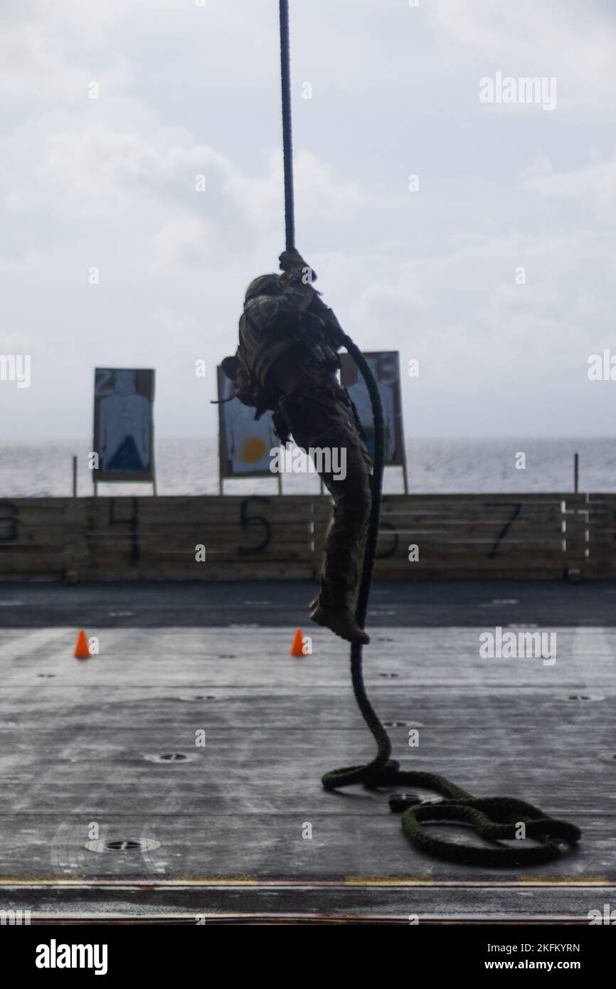 A U.S. Marine with Maritime Raid Force, 31st Marine Expeditionary Unit ...