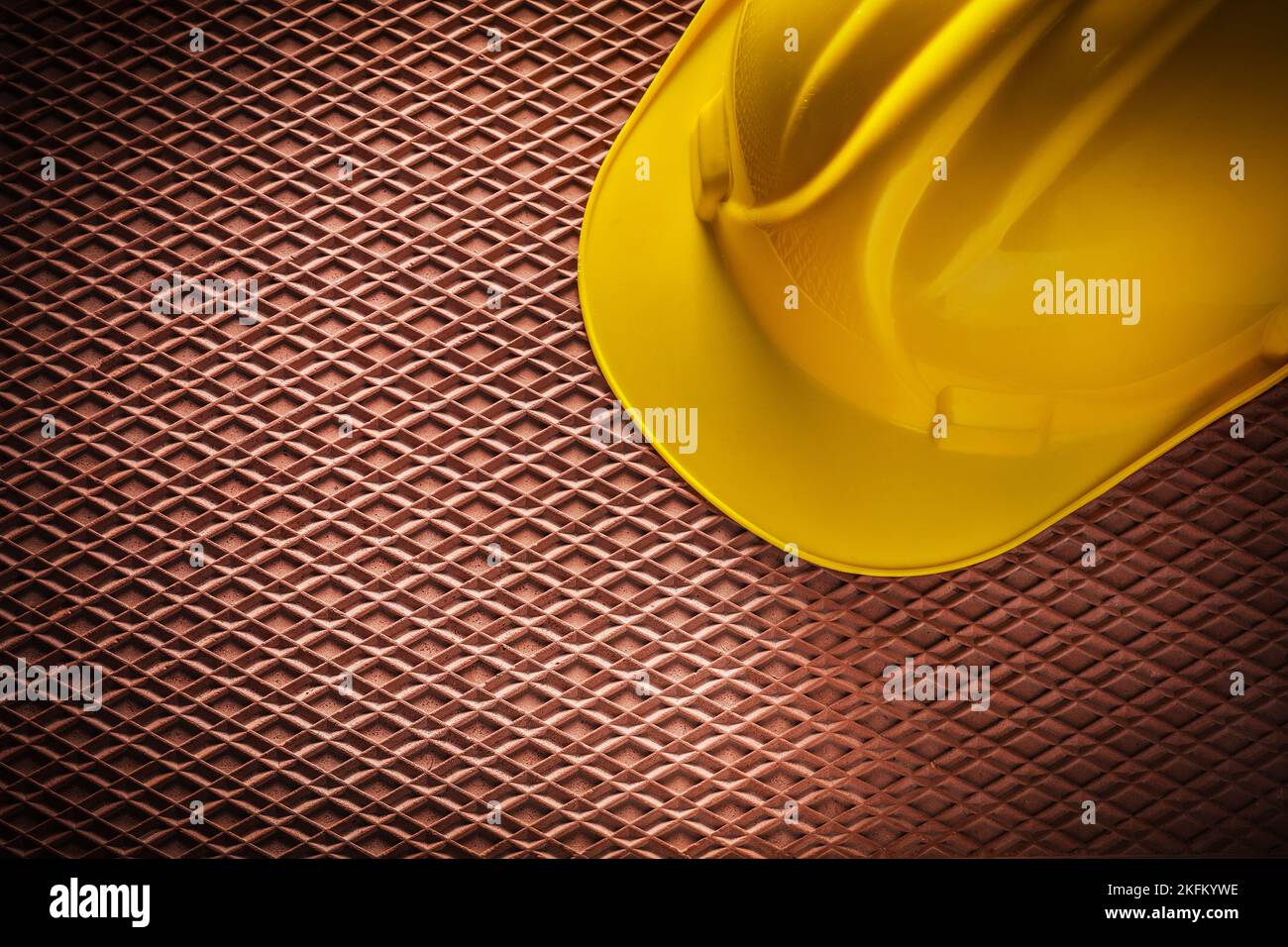 Building helmet on dielectric rubber matting Stock Photo - Alamy
