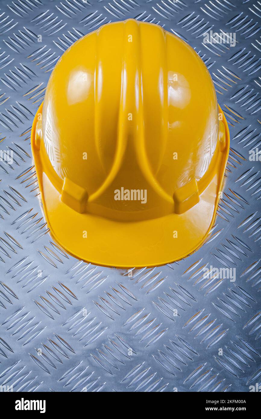 Building helmet on fluted metal background construction concept Stock ...