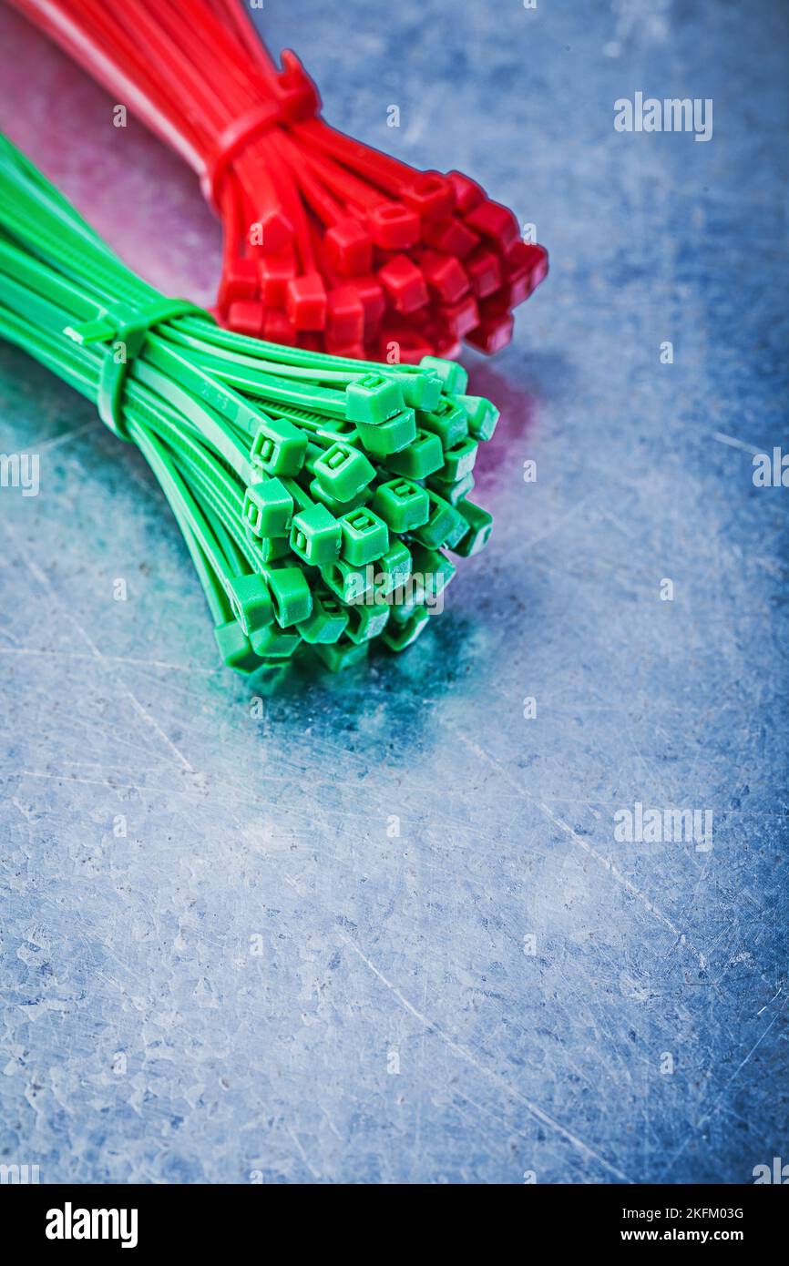 Bundle of cable ties on scratched metallic background construction ...