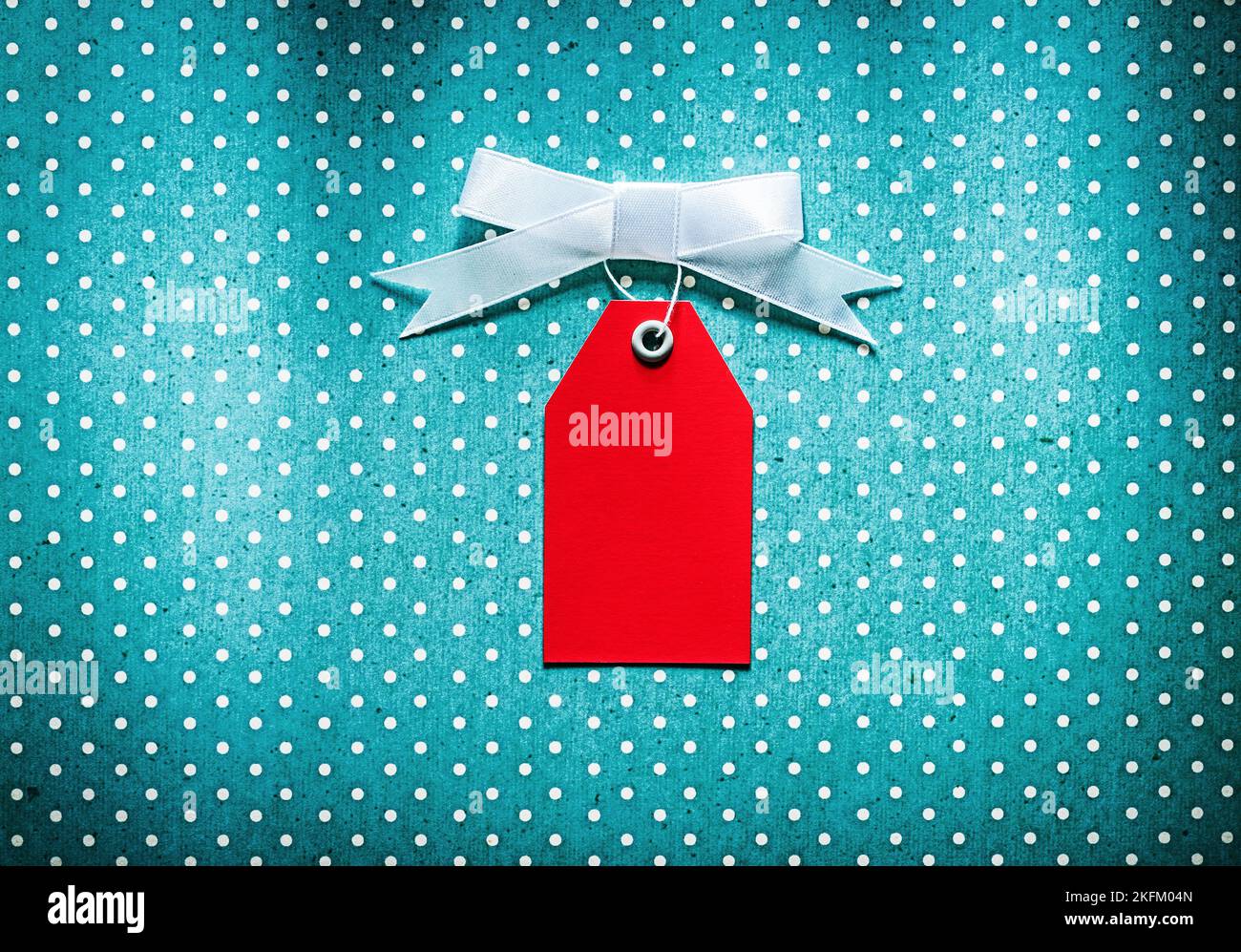 Cardboard price tag on blue polka-dot table cloth Stock Photo - Alamy