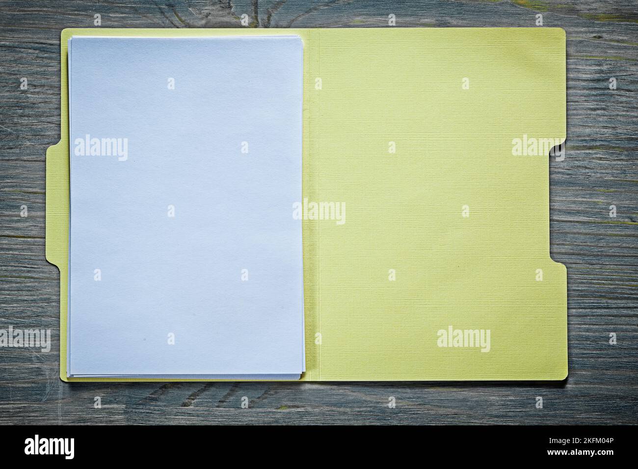 Cardboard office paper folder on wooden board Stock Photo - Alamy