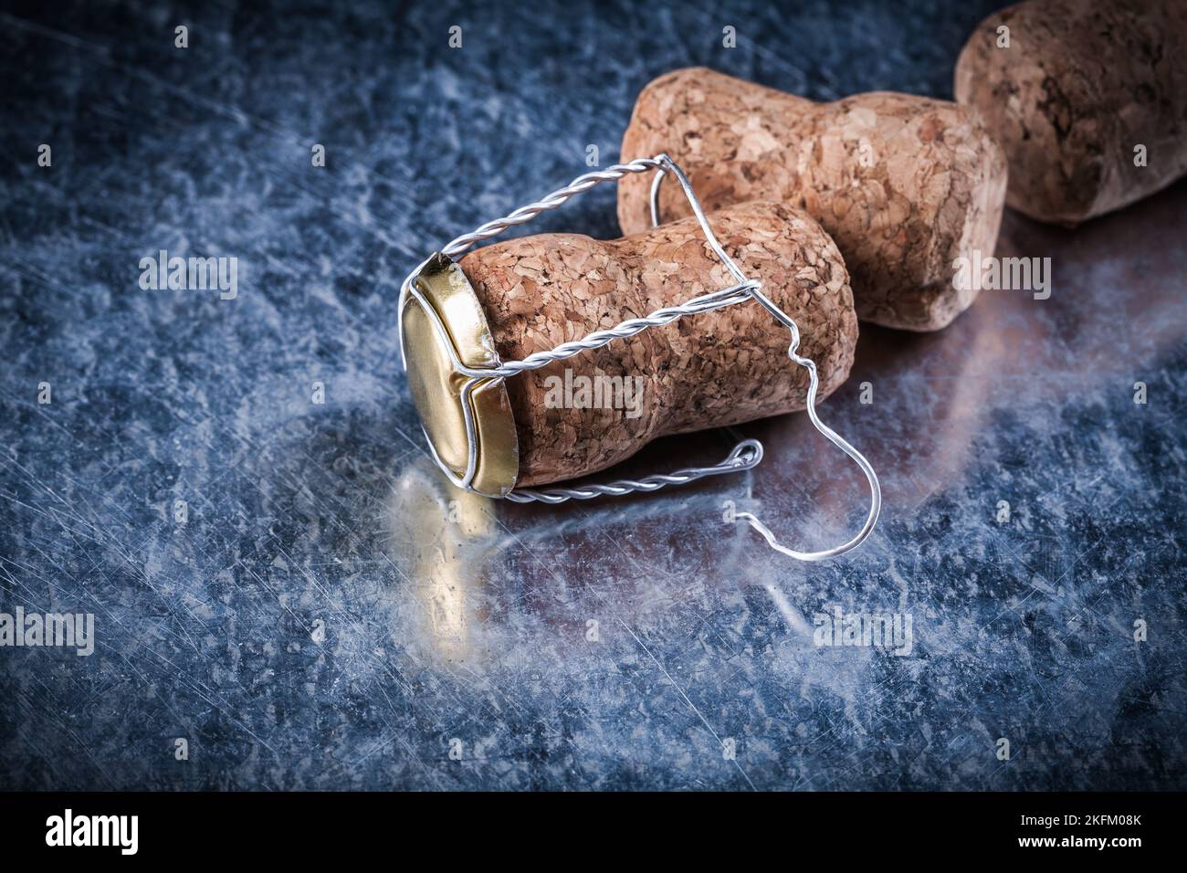 Champagne cork taps twisted wire on metallic background alcohol concept ...