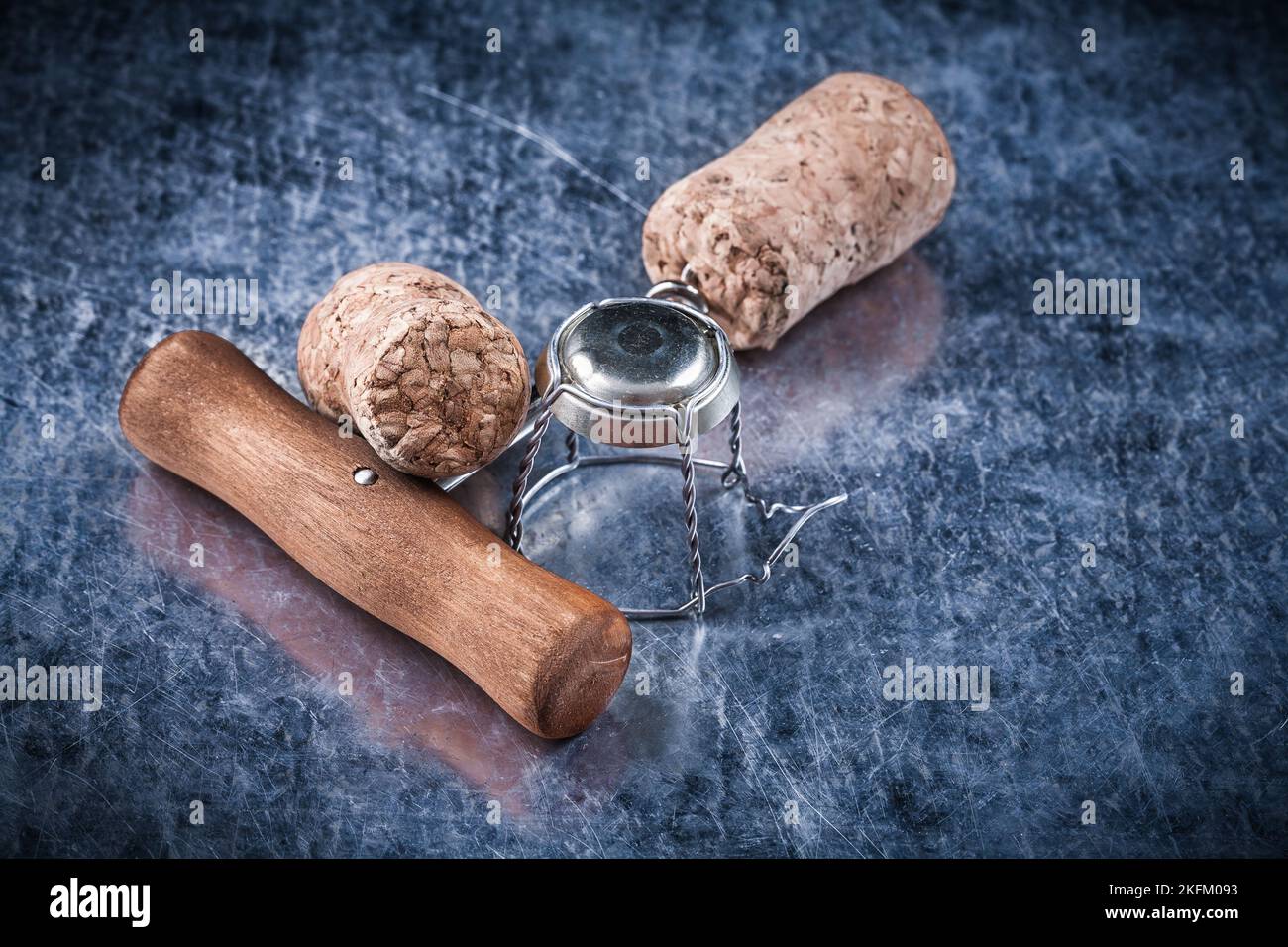 Champagne cork taps metal twisted wire corkscrew on metallic background ...