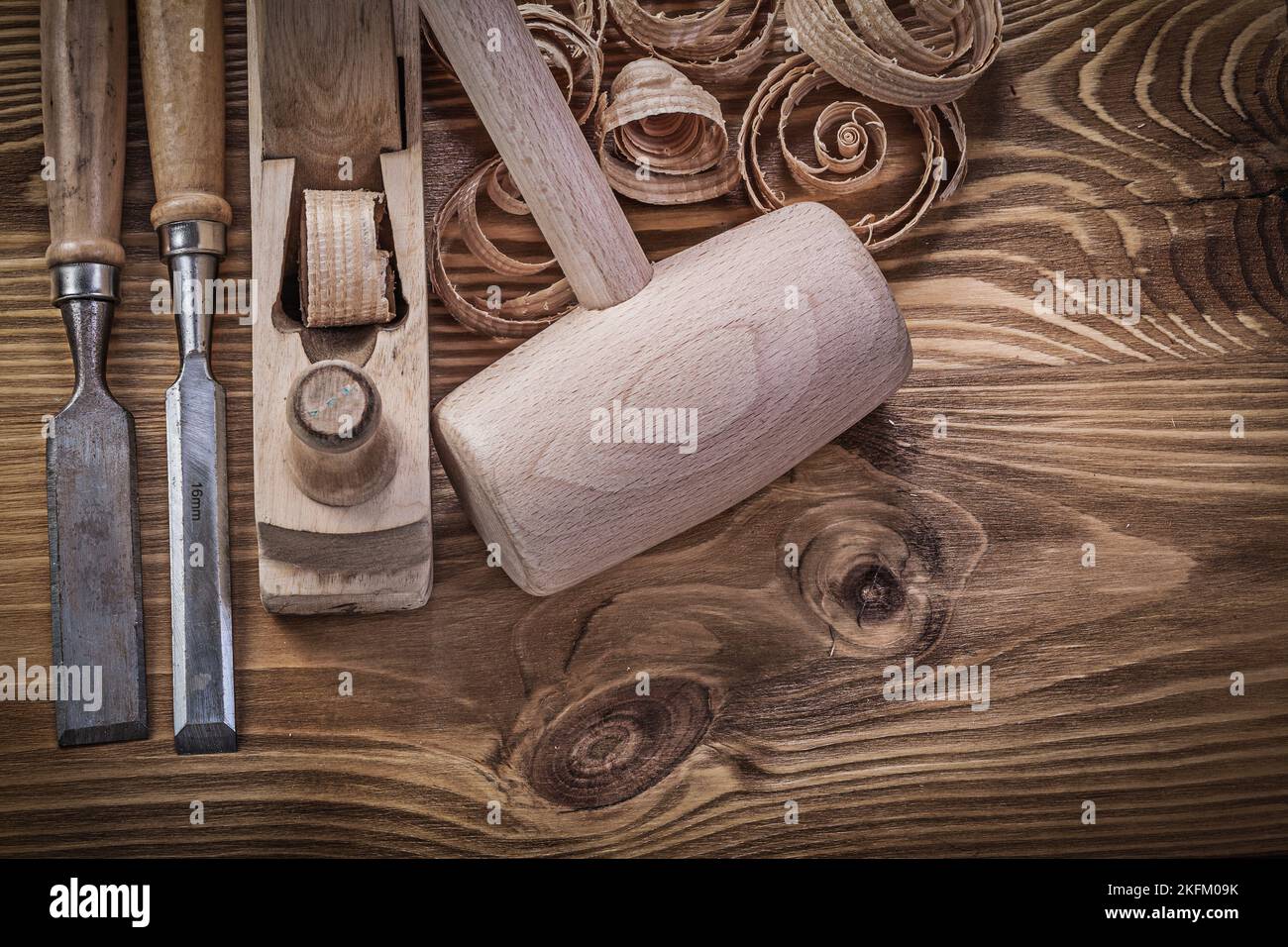Chisels shaving plane shavings wooden mallet on wood board construction ...