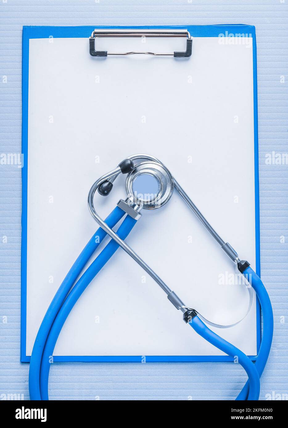 classical stethoscope on clipboard with white blank sheet of paper on ...