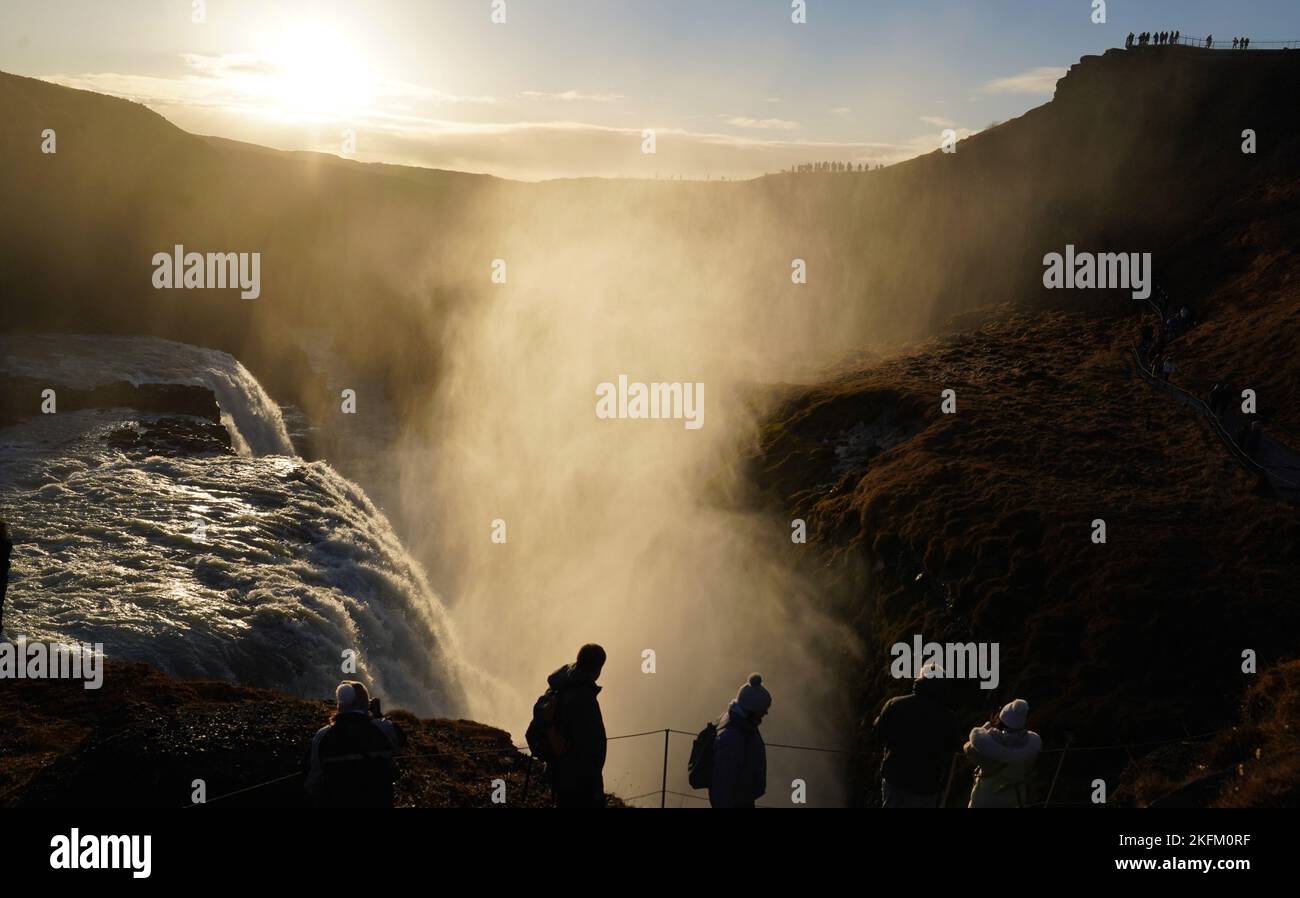 A rainbow appears through the spray at Gullfoss waterfall on the south ...