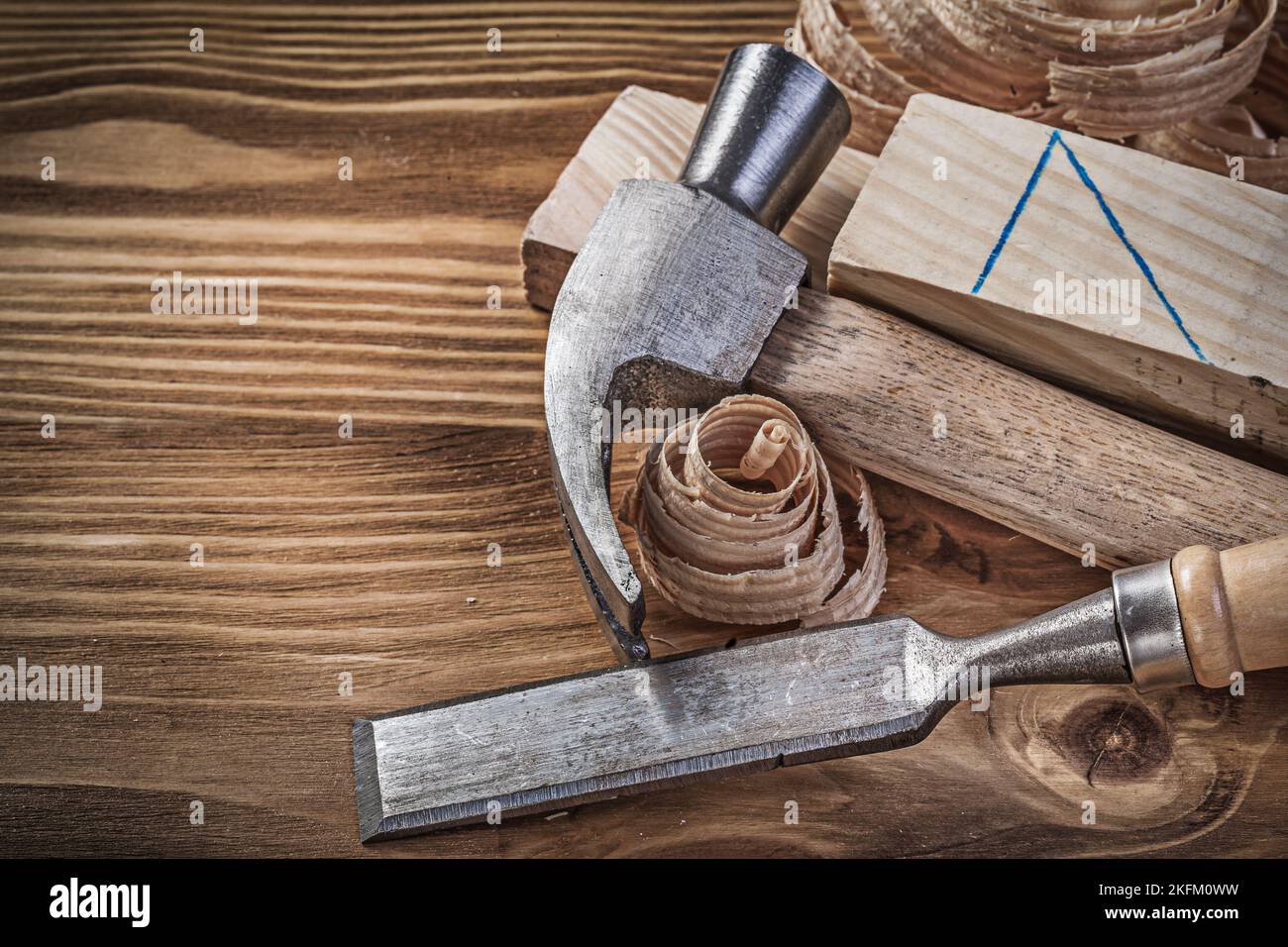 Claw hammer firmer chisel wooden studs shavings on vintage wood board ...