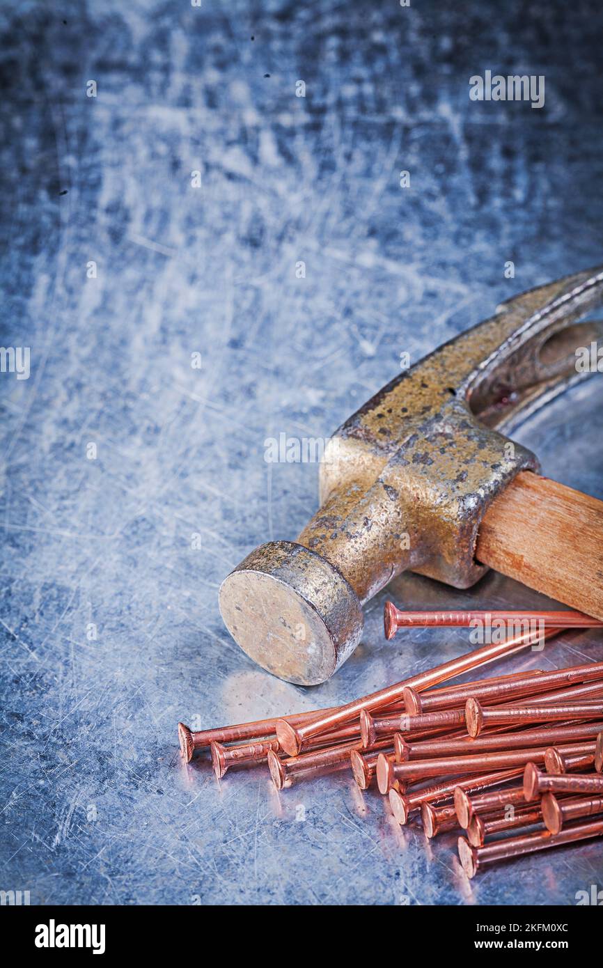 Claw hammer brass construction nails on metallic background Stock Photo ...