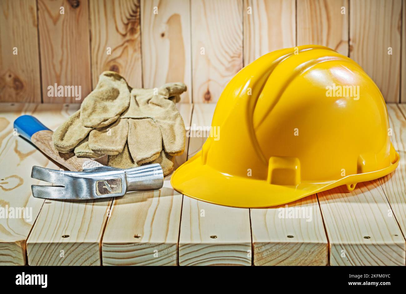 claw hammer ane yellow helmet with leather working gloves Stock Photo ...