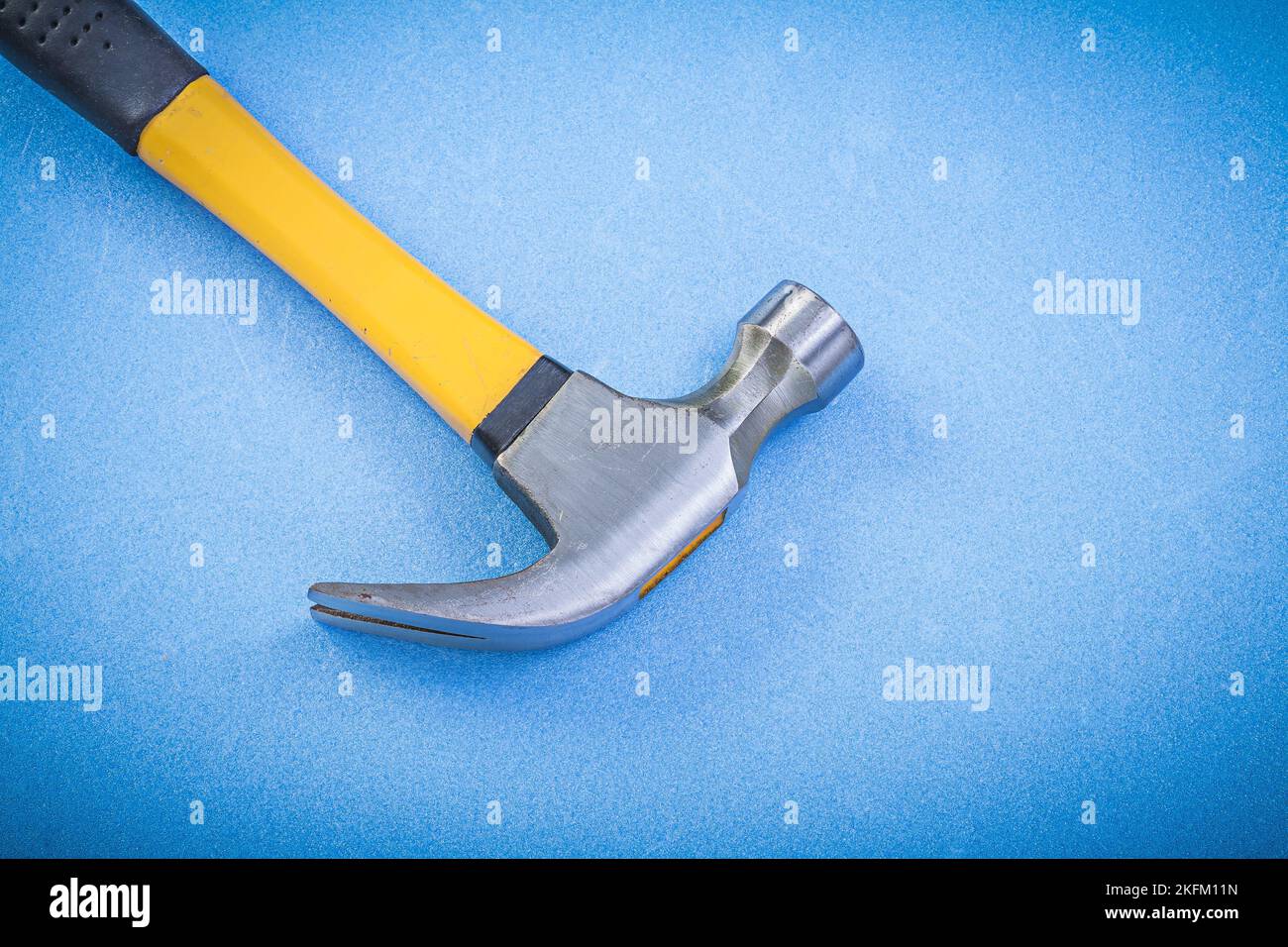 Claw hammer with handle on blue background construction concept Stock ...