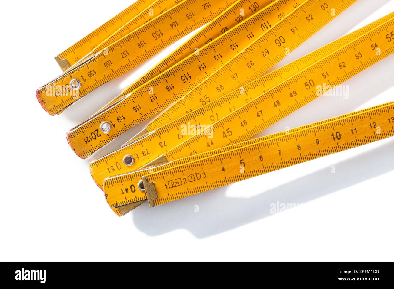 close up view yellow wooden meter isolated on white Stock Photo - Alamy