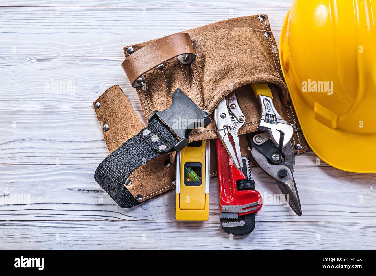 Collection of construction tooling in leather tool belt safety building ...