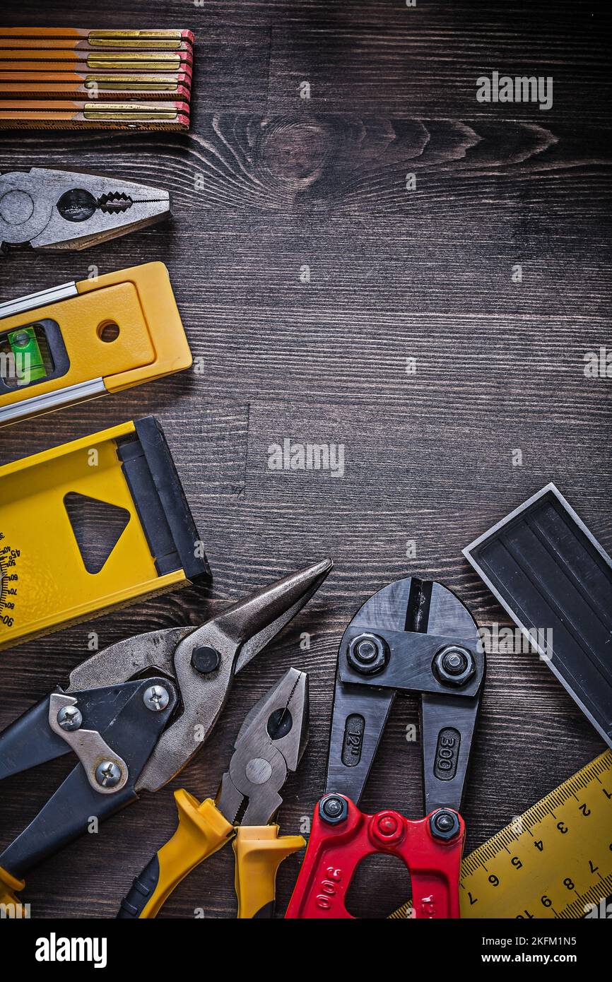 Collection of construction items on wooden background maintenance ...