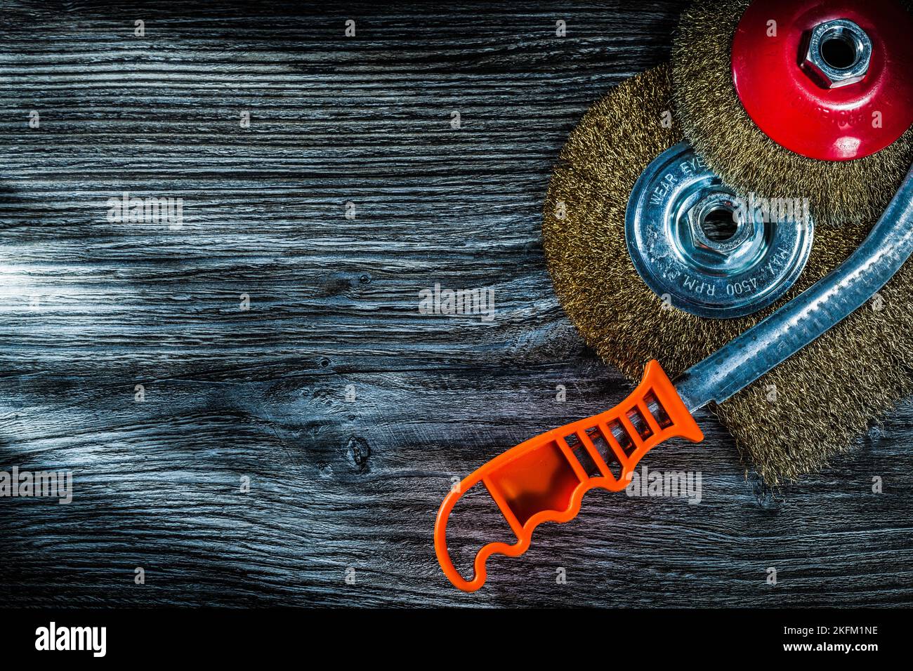 Collection of scratch wire brushes on vintage wooden board Stock Photo ...