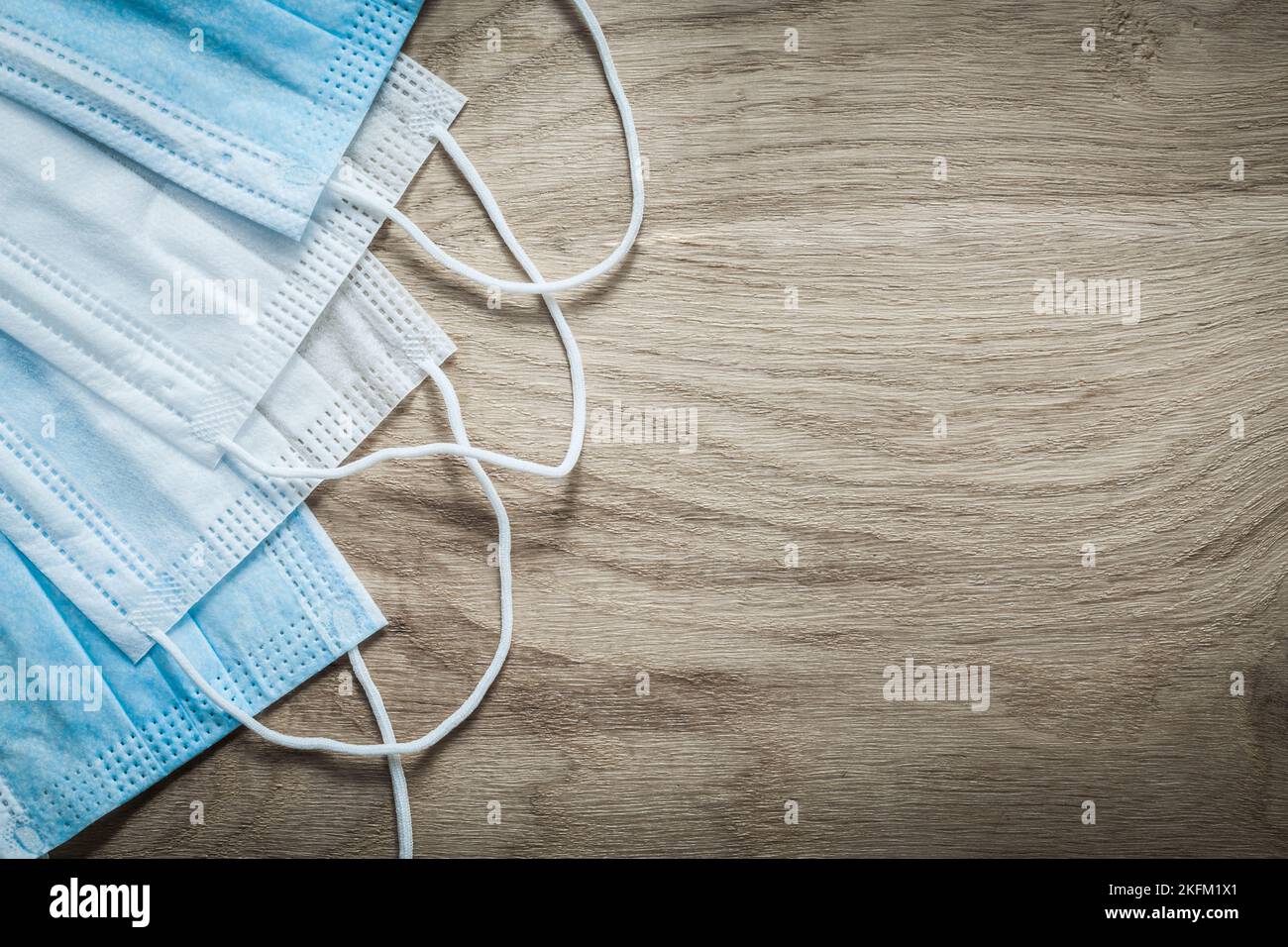 Composition of face sterile masks on wooden board Stock Photo - Alamy