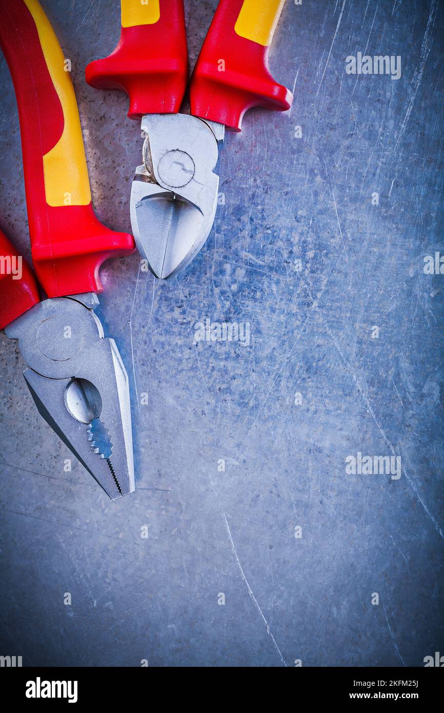 Composition of pliers wire-cutter on metallic background electricity ...