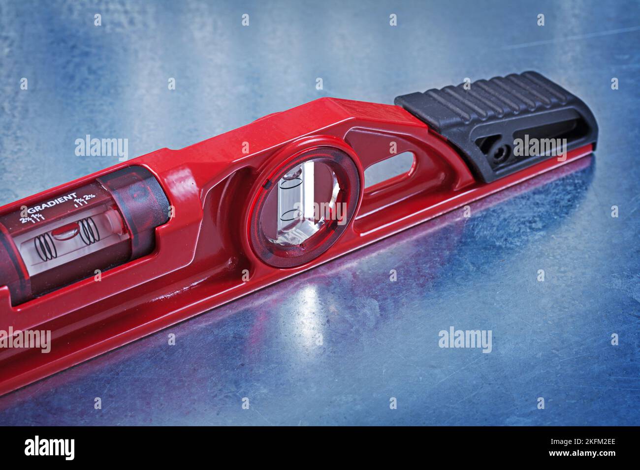 Construction level on scratched metallic background Stock Photo - Alamy