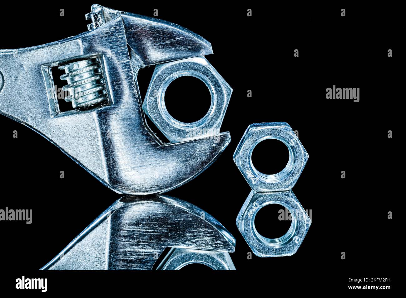 Construction nuts adjustable spanners on black background Stock Photo ...