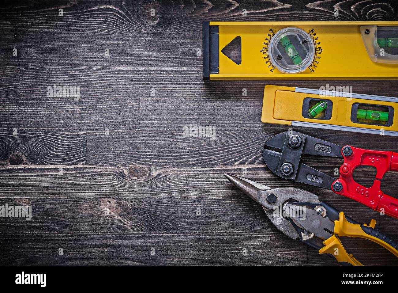 Construction levels steel cutter tin snips copy space Stock Photo - Alamy