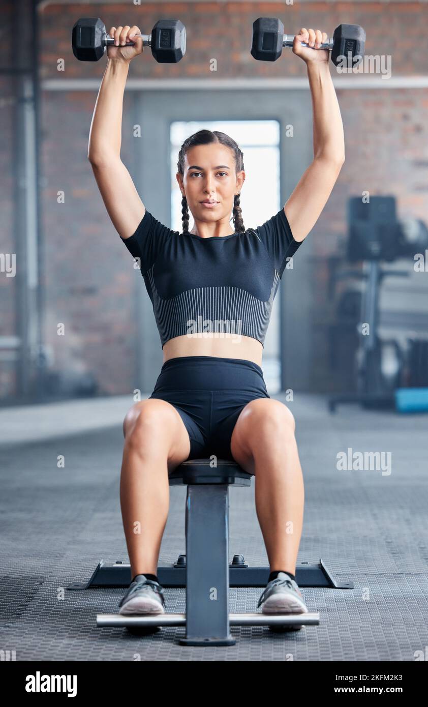 Fitness, workout and woman with dumbbells in gym training for ...