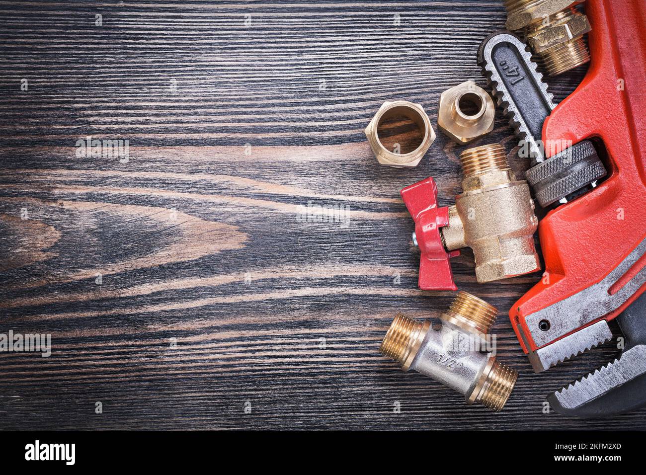 Copy space of brass plumbing equipment on wooden board construction ...