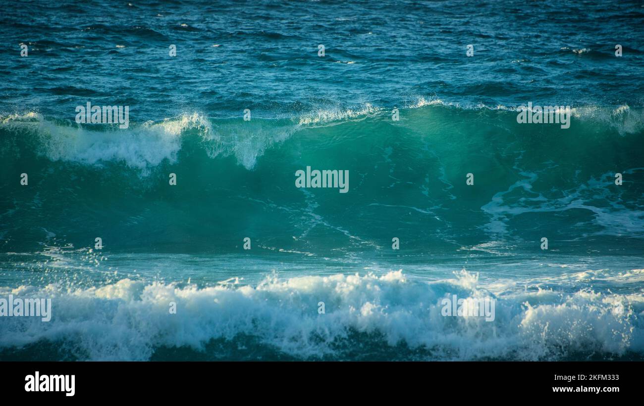 Powerful large turquoise colored waves crashing at Sennen Cove in ...