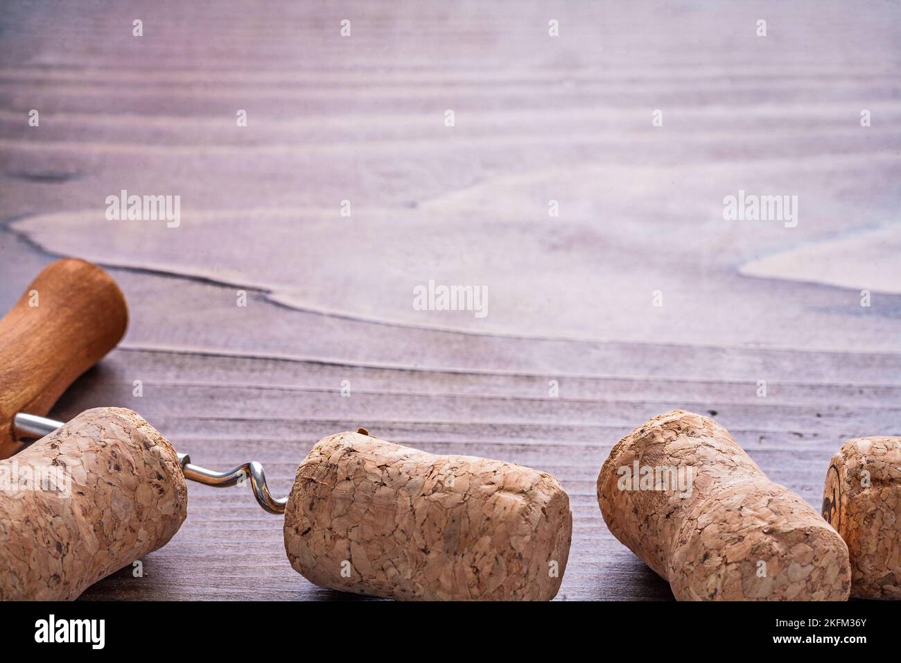 corks of champagne very close up on vintage wooden board with big ...