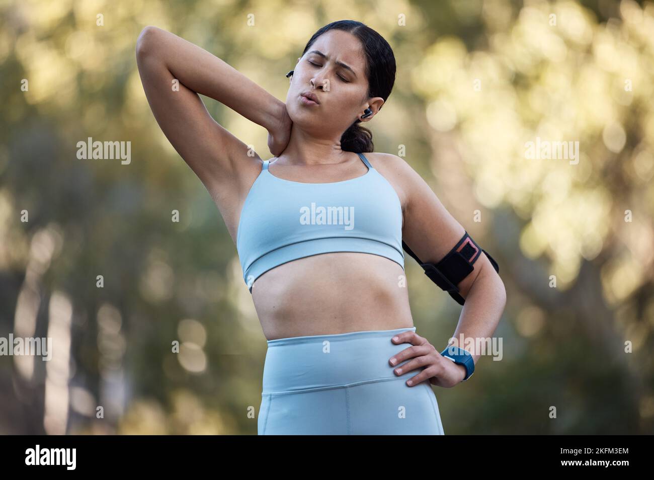 Fitness, exercise and neck pain with a sports woman holding a muscle or ...