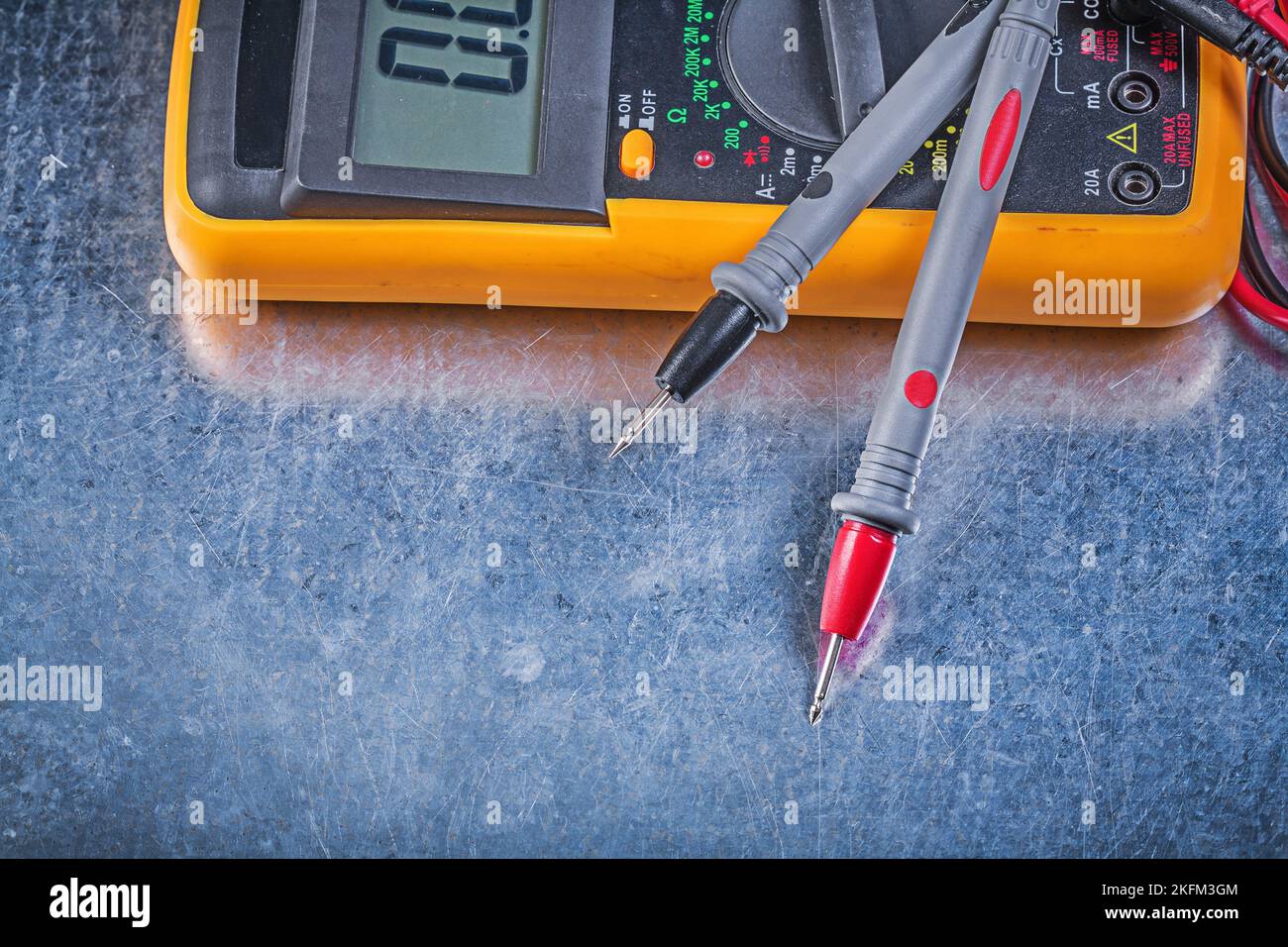 Digital electric tester test leads on metallic background Stock Photo ...