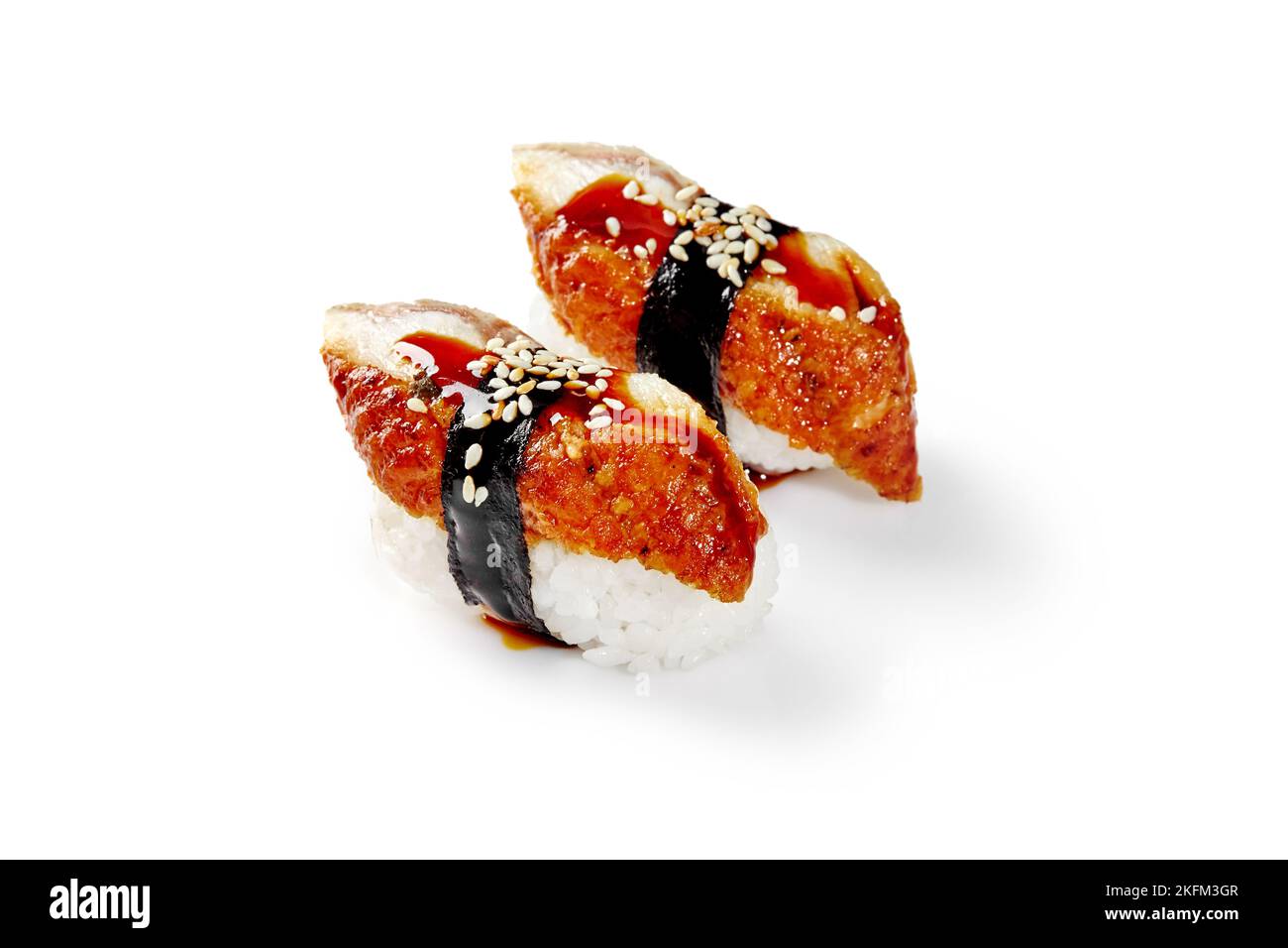 Two nigiri sushi with eel, unagi sauce and sesame on white Stock Photo - Alamy