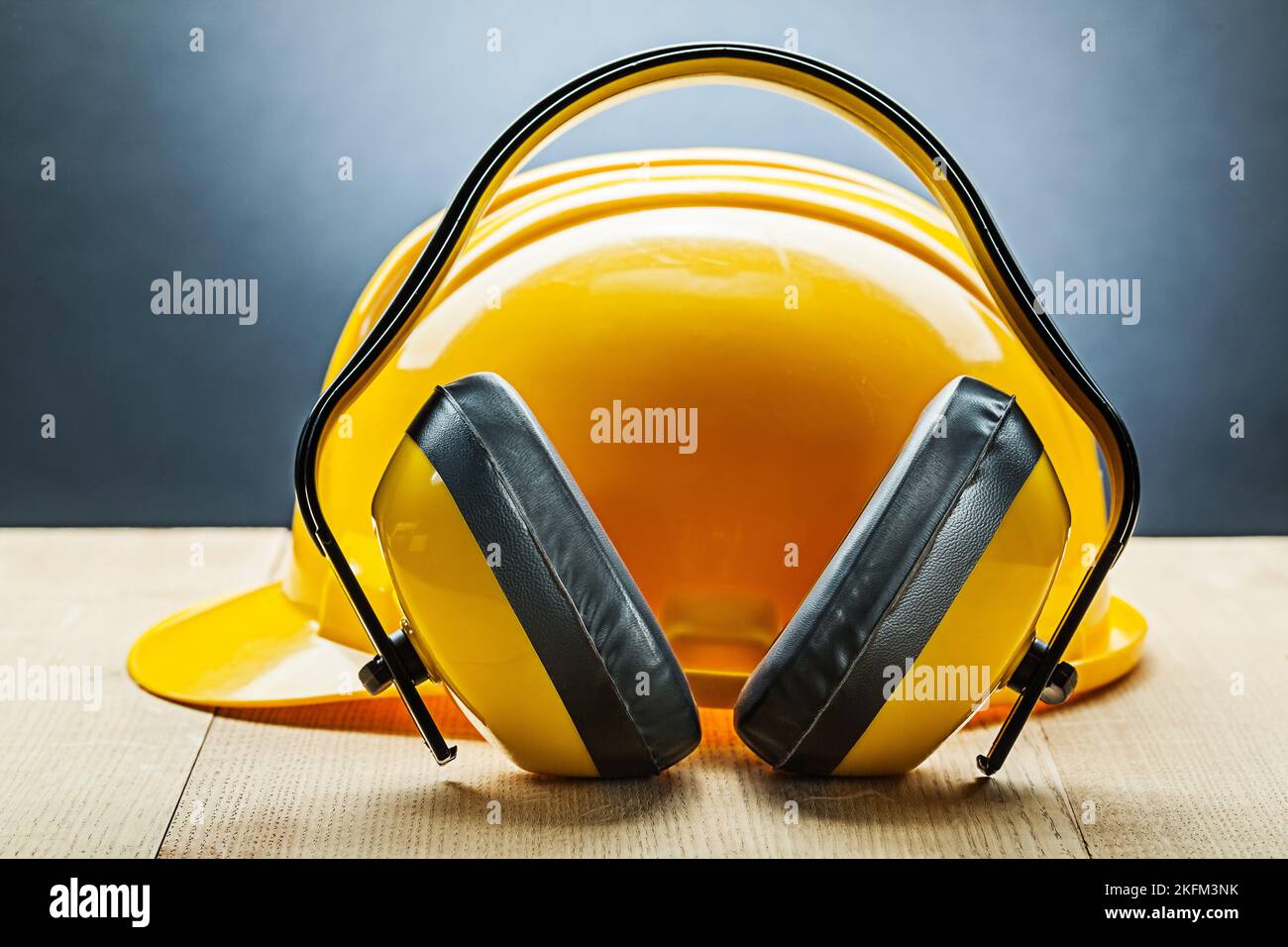 earphones with yellow construction helmet Stock Photo - Alamy