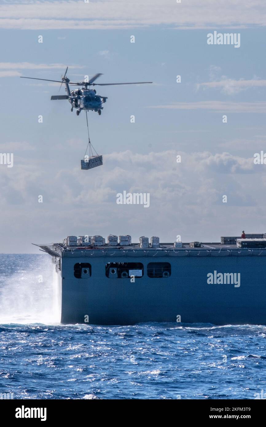 Sailors aboard dry cargo and ammunition ship USNS Medgar Evers (T-AKE ...
