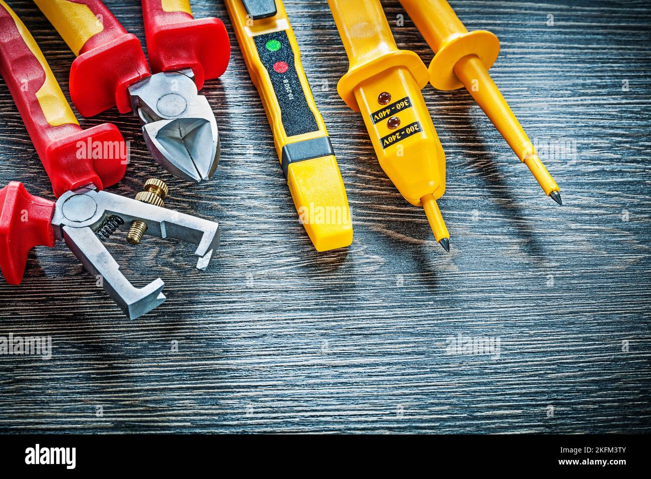 Electric tester nippers insulated strippers on wooden board Stock Photo ...