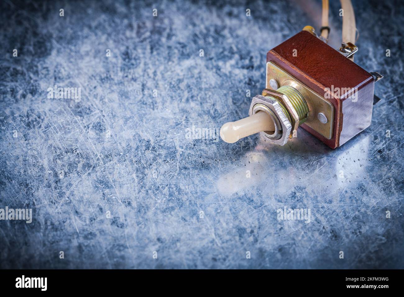 Electric toggle switch on scratched metallic background copyspace image ...