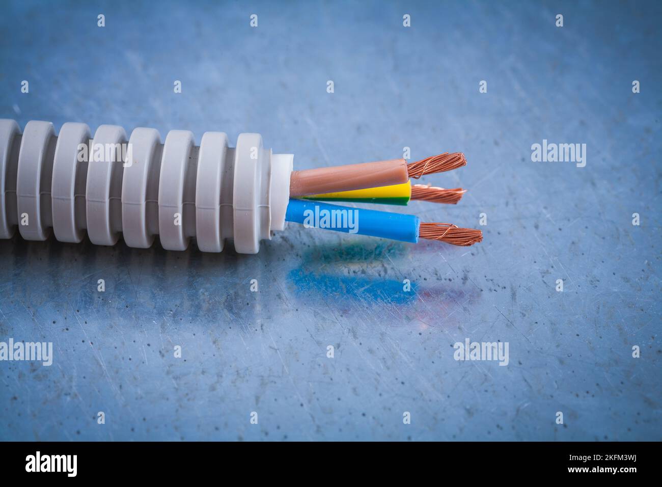 Electric wire protection and copper cables on scratched metallic ...