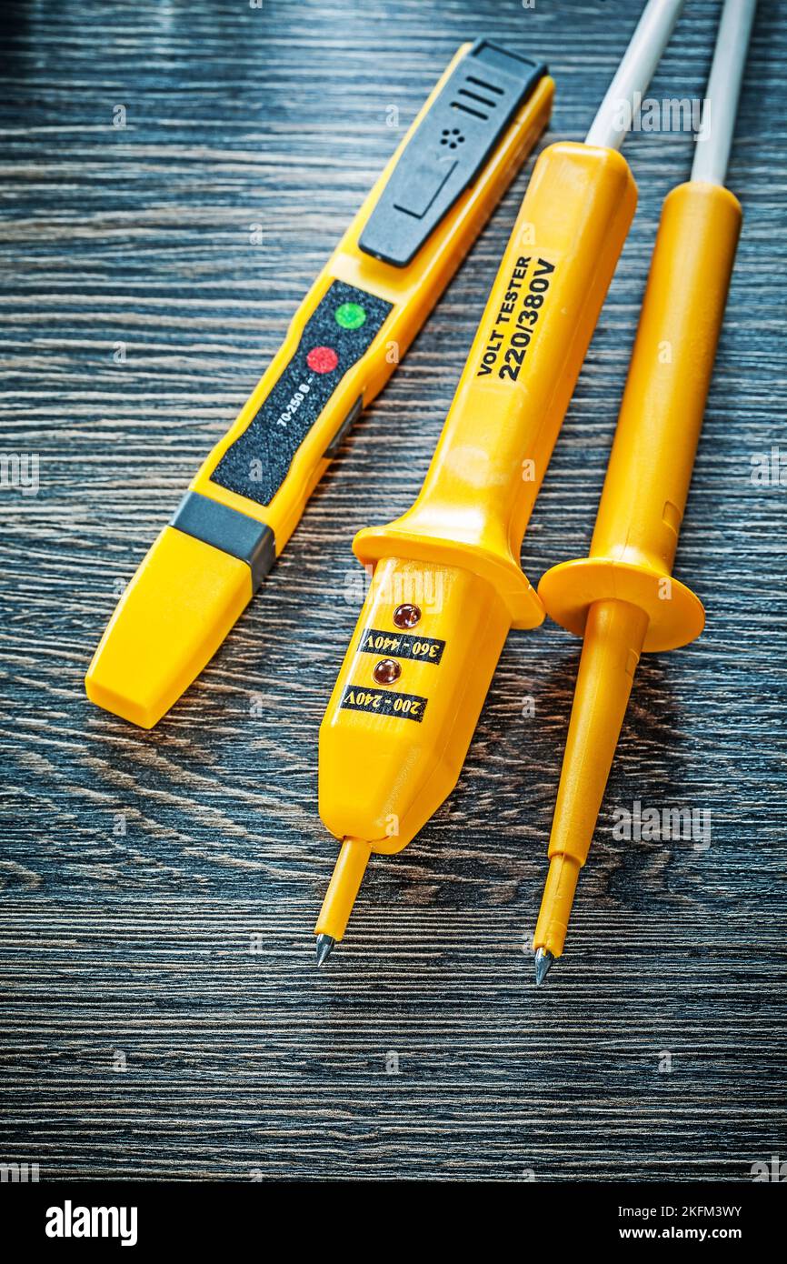Electric testers on wooden board directly above Stock Photo - Alamy