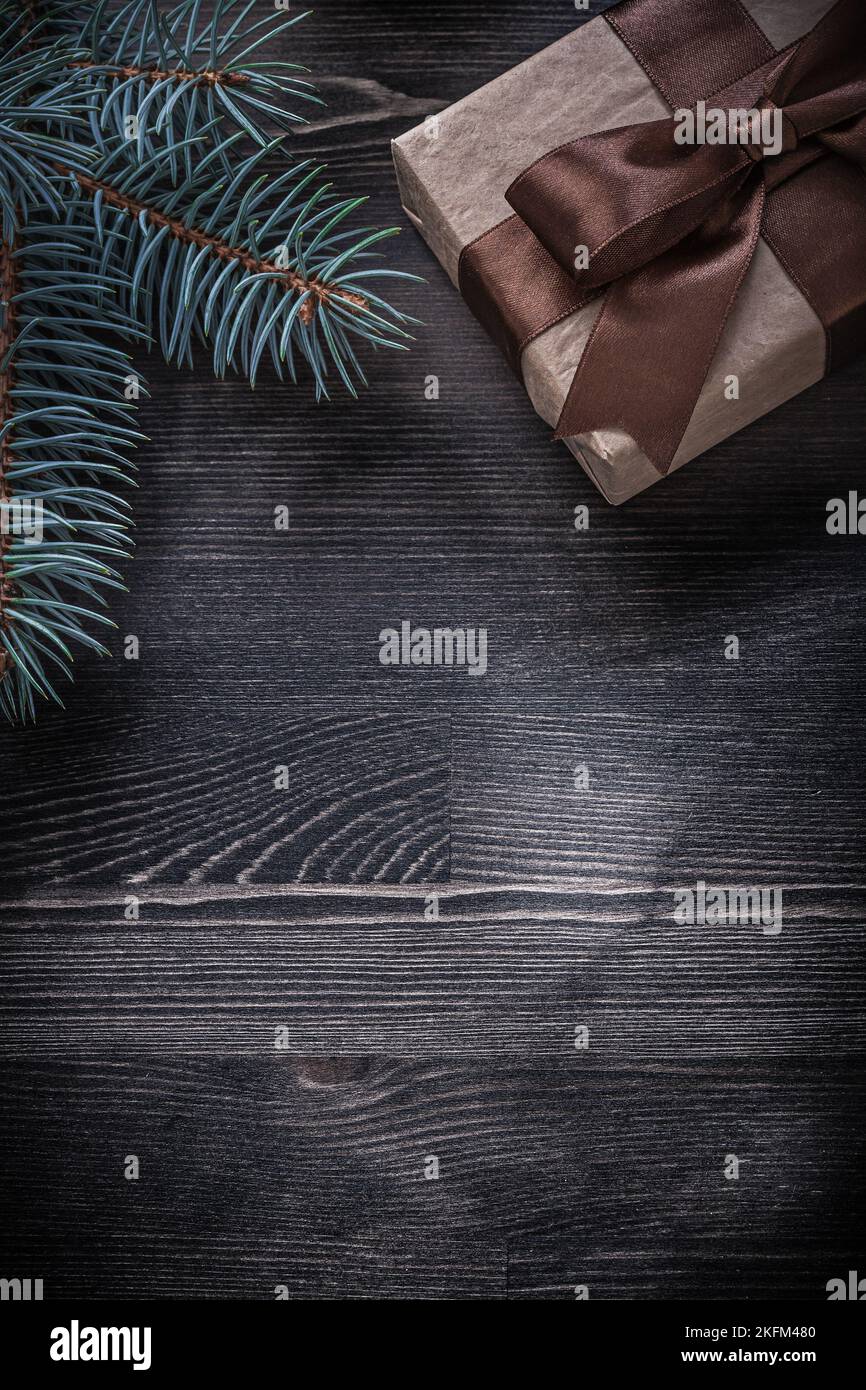 Fir tree branch present box on wooden board holiday concept Stock Photo ...